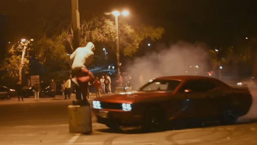 Dodge Challenger Doing Donuts Almost Hits Bystander