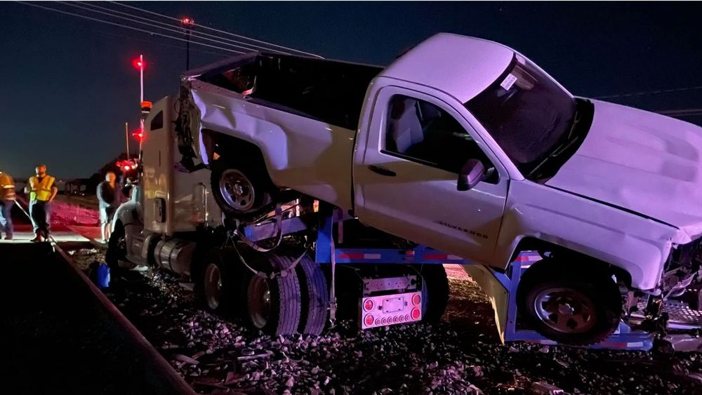 Train Slams Into Car Transporter